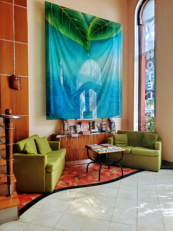 Vibrant artwork brings tropical energy to this sitting area, where waiting actually becomes a pleasure rather than a smartphone-scrolling purgatory.