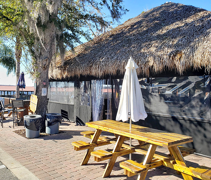 Shaded outdoor seating provides the perfect vantage point for watching river life unfold while enjoying refreshments from the nearby bar.