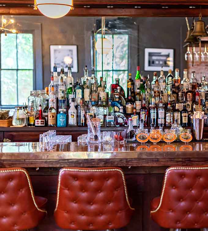 The bar area gleams with possibility, stocked with enough options to make any decision feel like the right one.
