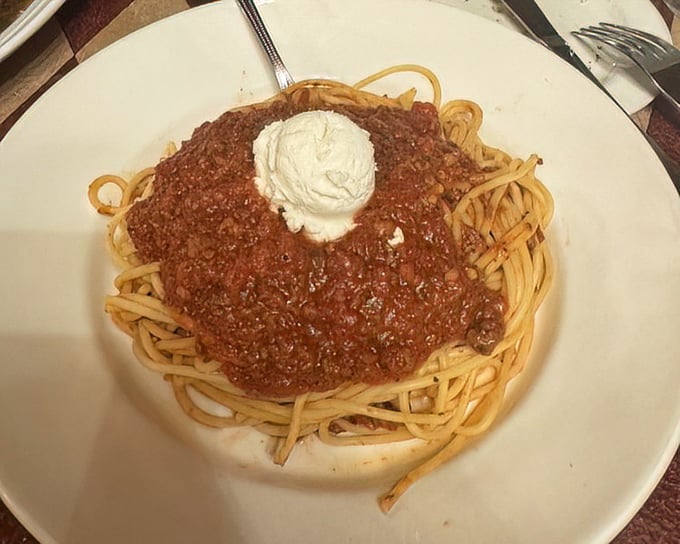 Spaghetti with meat sauce crowned with a dollop of ricotta &ndash; simple, classic, and exactly what your soul has been craving all along.