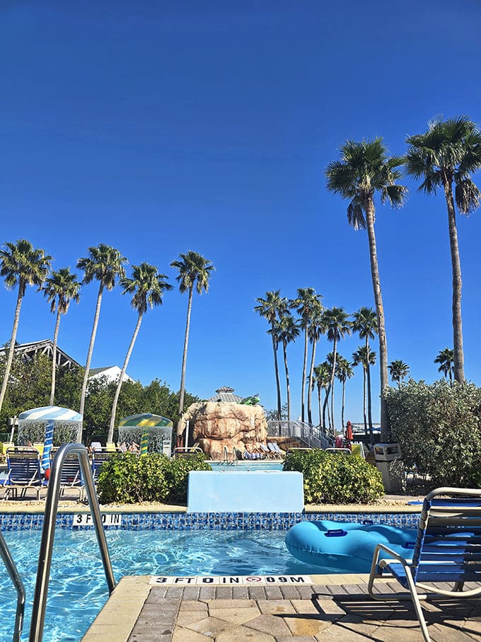 Splash Harbour Water Park sparkles under Florida sunshine, palm trees swaying, blue water calling, and carefree fun waiting poolside.
