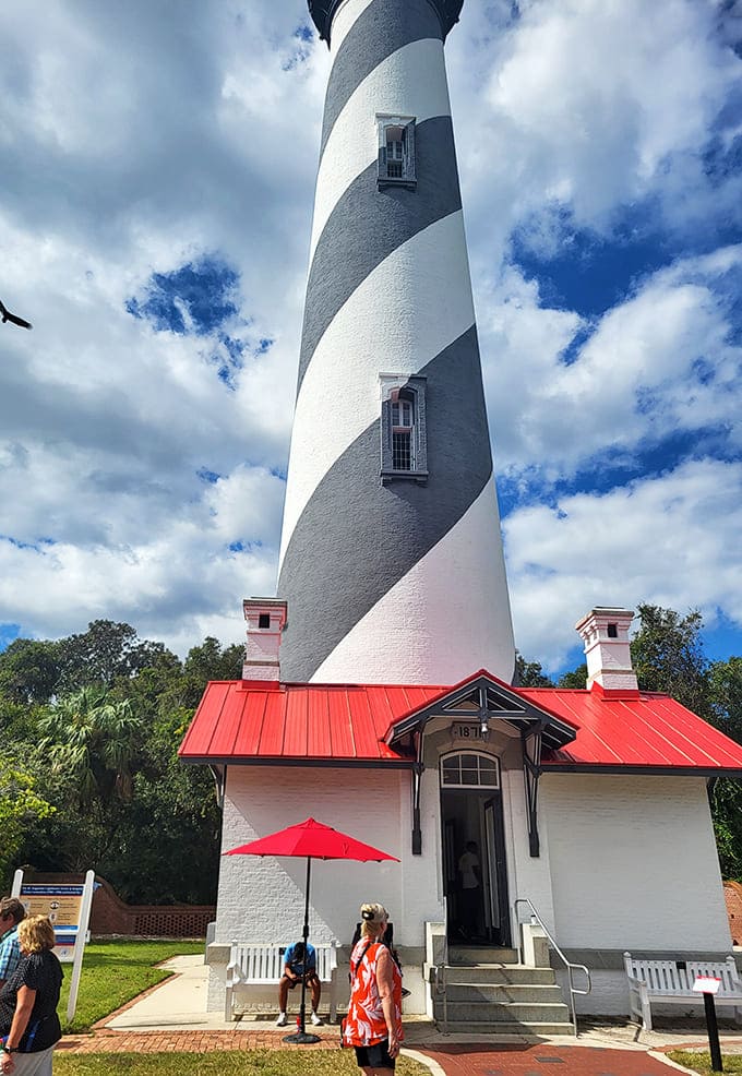 The lighthouse base reveals the solid foundation that's kept this beacon standing through hurricanes, time, and countless selfie-taking tourists.