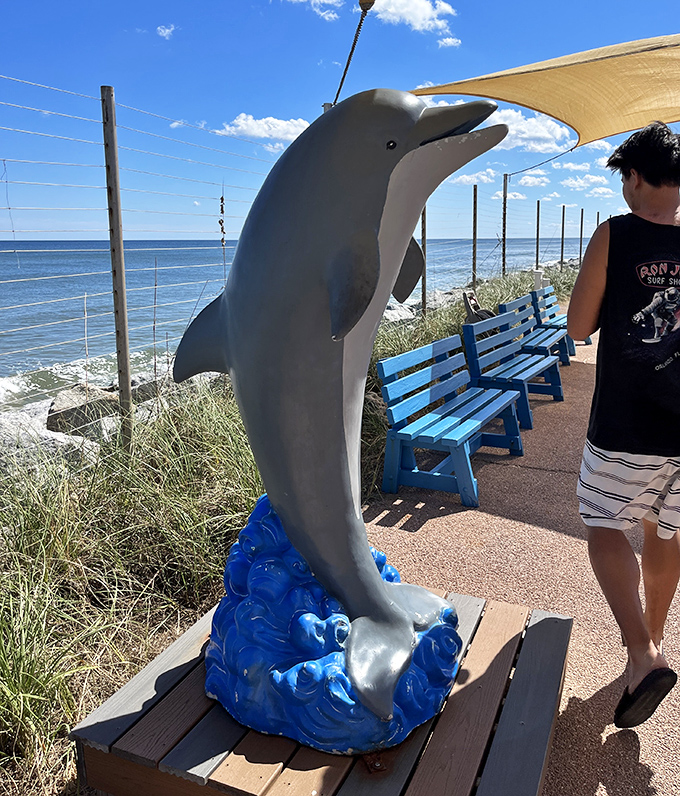 This dolphin statue stands as a silent greeter, never asking for fish and never splashing unsuspecting visitors &ndash; unlike its living counterparts.