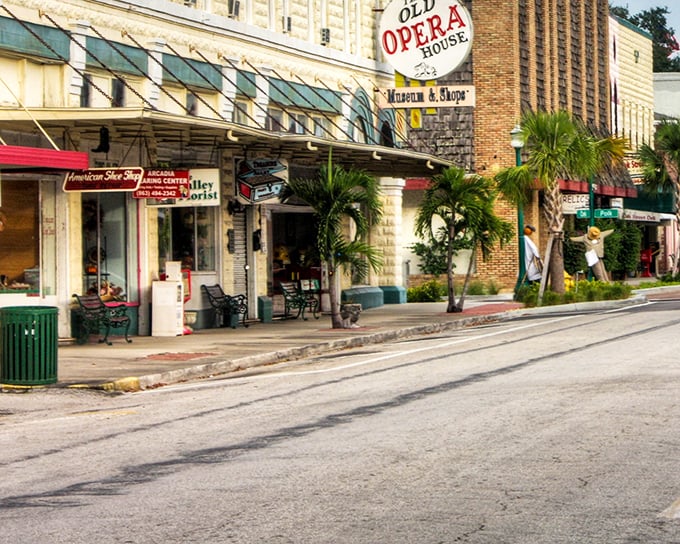 Modern vehicles park along timeless storefronts, where shoppers hunt for treasures behind windows that have framed Arcadia's street life for decades.