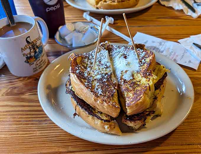 French toast dusted with powdered sugar, looking like it just returned from a very successful vacation in breakfast paradise.