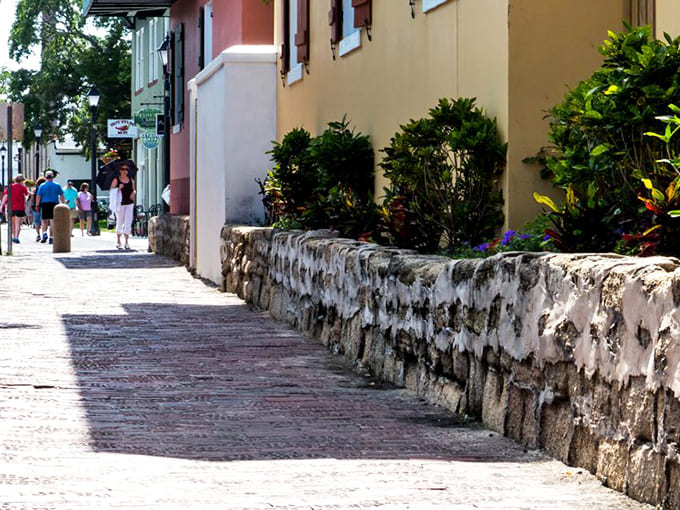 Another angle shows how the street's narrowness creates dramatic shadows and light, turning a simple walk into an atmospheric journey through time.