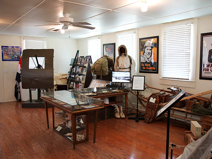 Display tables packed with artifacts, documents, and equipment create an immersive experience that brings textbook history into three-dimensional reality you can actually see and touch.