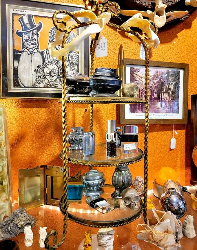 This twisted gold display stand showcases an eclectic collection that spans centuries &ndash; from Victorian trinkets to mid-century treasures, all waiting for new homes.