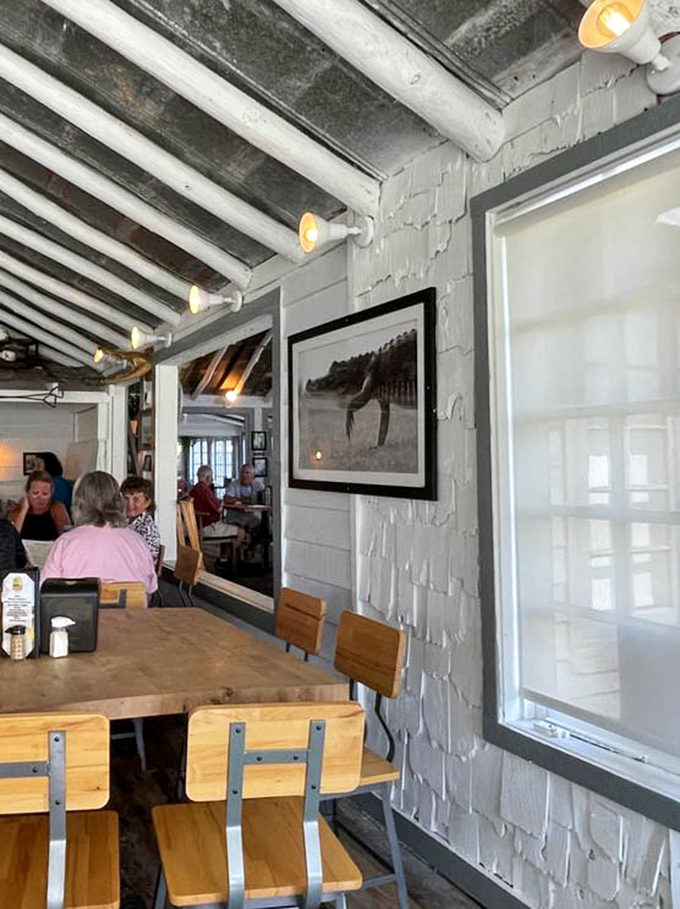 The restaurant's interior walls showcase local photography, connecting diners to the natural beauty that surrounds this waterfront haven.