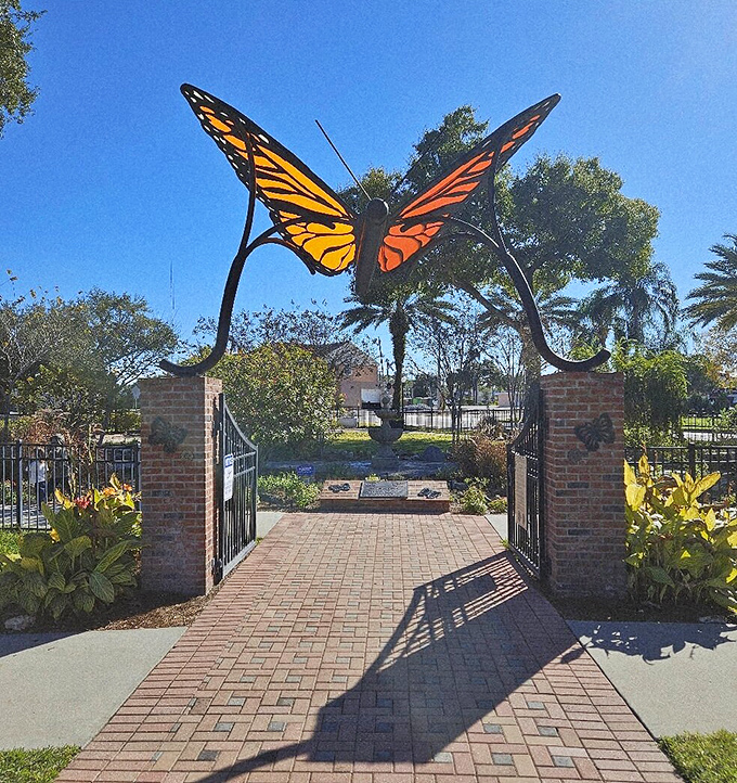 The butterfly garden entrance features this stunning sculpture, its vibrant wings symbolizing the transformation this park brings to everyday life.