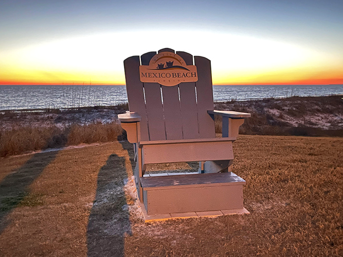 The oversized Mexico Beach chair frames the sunset perfectly – an Instagram moment waiting to happen.
