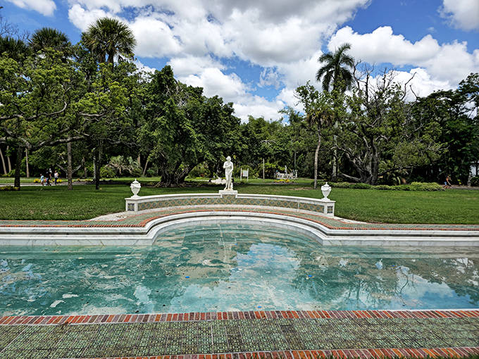 Reflecting pools mirror the Florida sky, offering moments of serenity amid the estate's cultural riches.