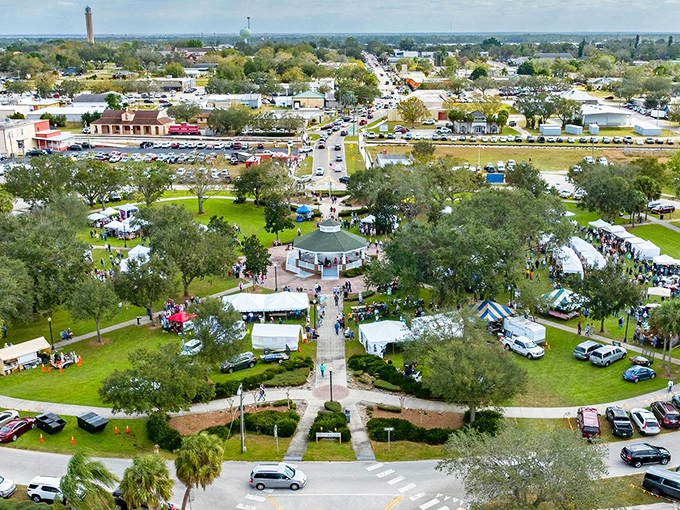Festival central! Lake Placid's circular park buzzes with community spirit around its wedding-cake gazebo.