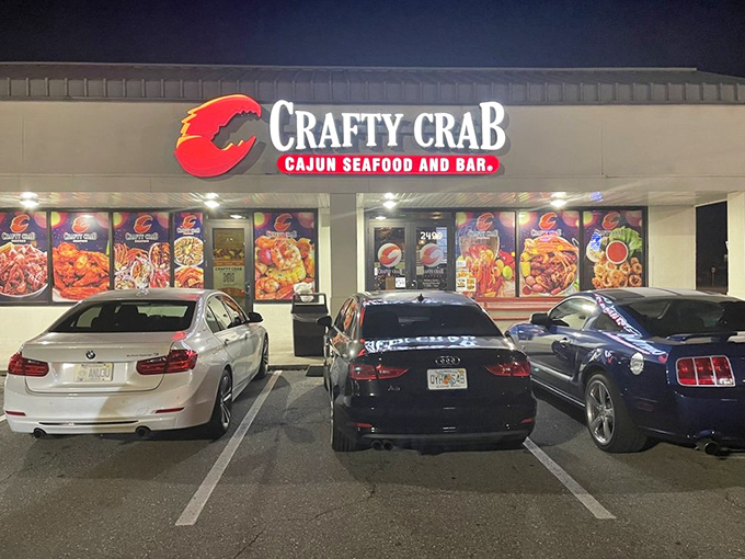 At night, Crafty Crab's illuminated storefront becomes a beacon for seafood lovers. The bright displays hint at the flavorful feast waiting inside.