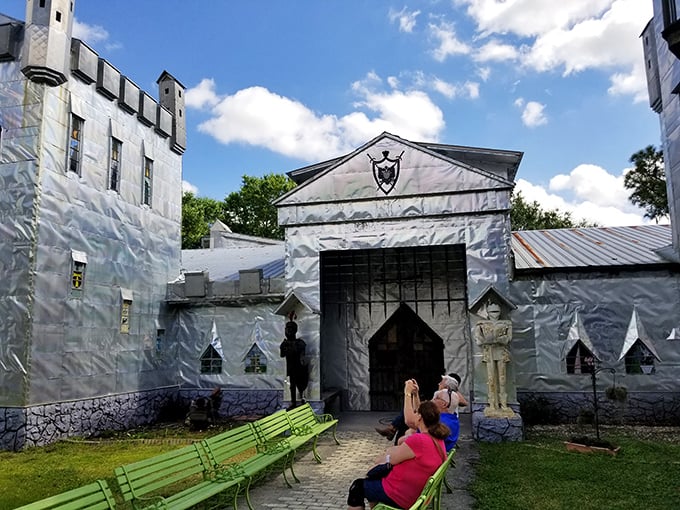 The entrance to this handcrafted castle welcomes visitors to explore a world where recycled materials transform into whimsical art through one man's vision.