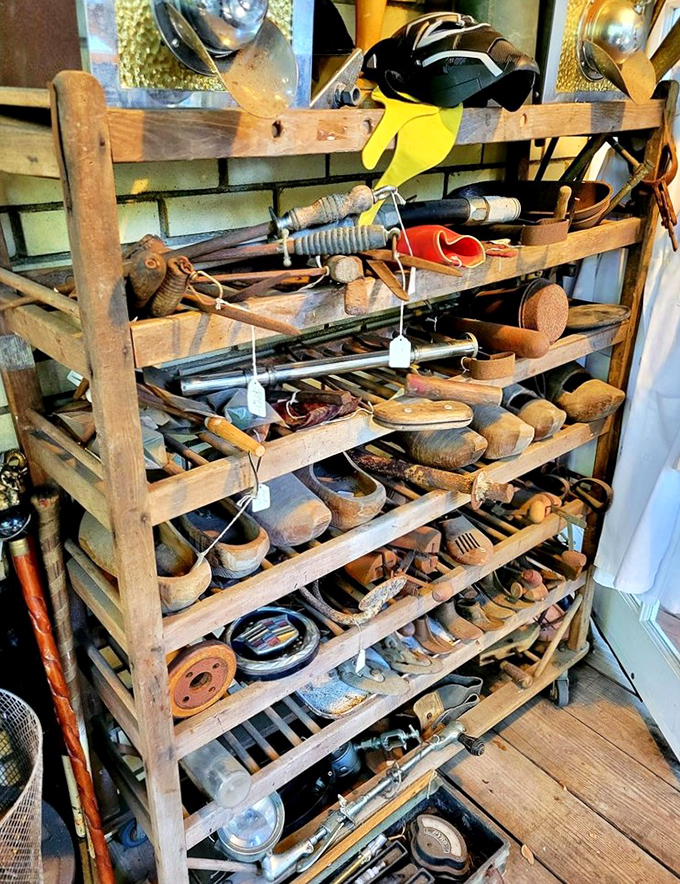 This wooden rack doesn't just hold tools &ndash; it cradles the handiwork of generations past, when craftsmanship was measured in decades, not production quotas.