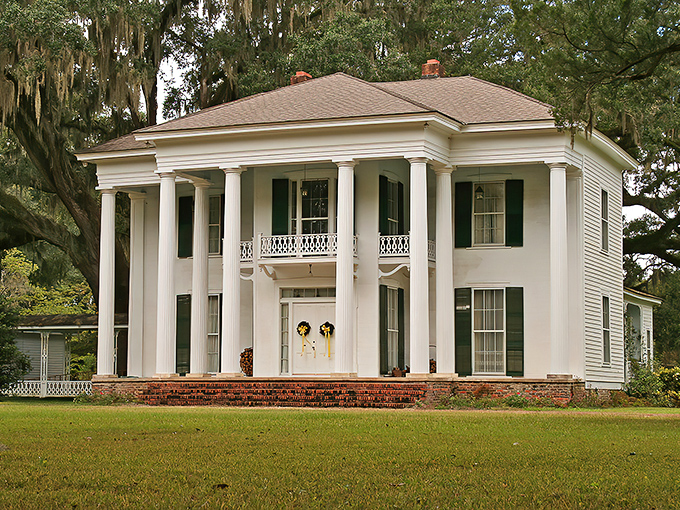The Bryan Mansion's stately columns and pristine facade offer a surprising glimpse of antebellum grandeur amid rural simplicity.