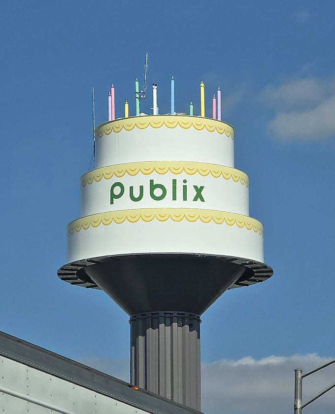The tower's pristine white exterior gleams in the sunshine, making it the cleanest birthday cake you'll ever encounter.