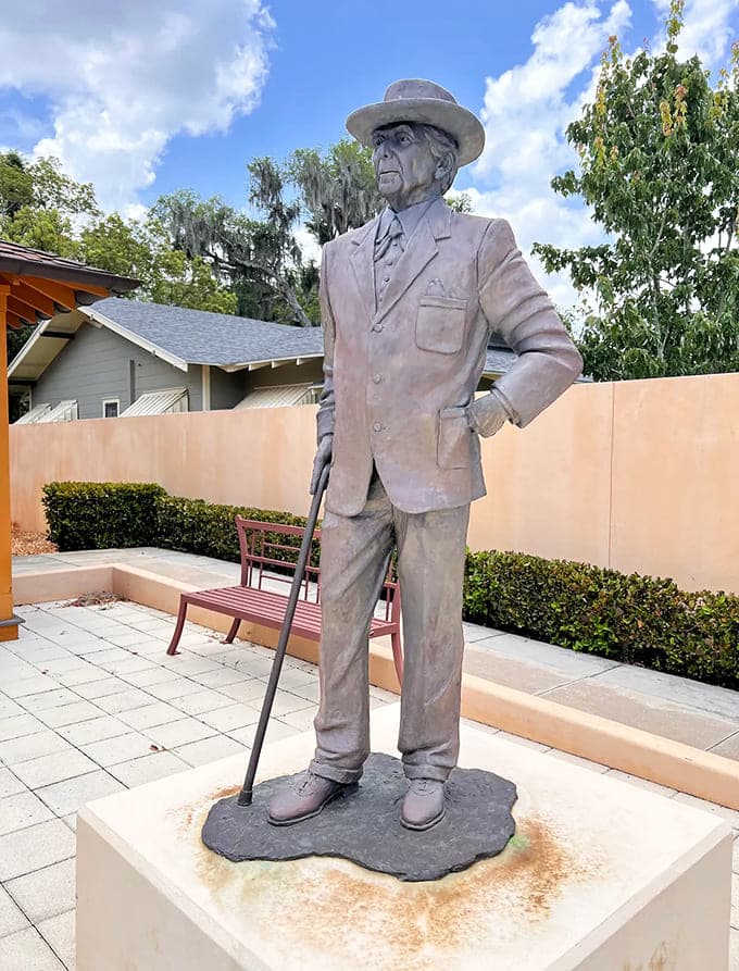 Frank Lloyd Wright himself stands eternal in bronze, probably still critiquing everyone's design choices from his permanent perch.
