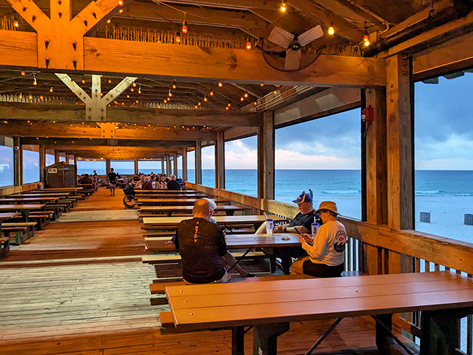 The covered deck offers panoramic Gulf views where diners can watch dolphins play while enjoying some of Florida's finest seafood.