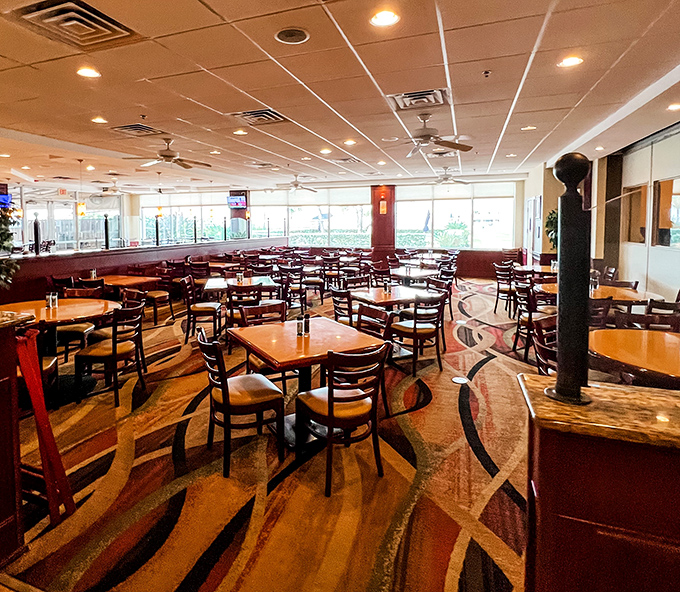 The spacious dining area features warm woods and plenty of seating for those seeking air-conditioned comfort.