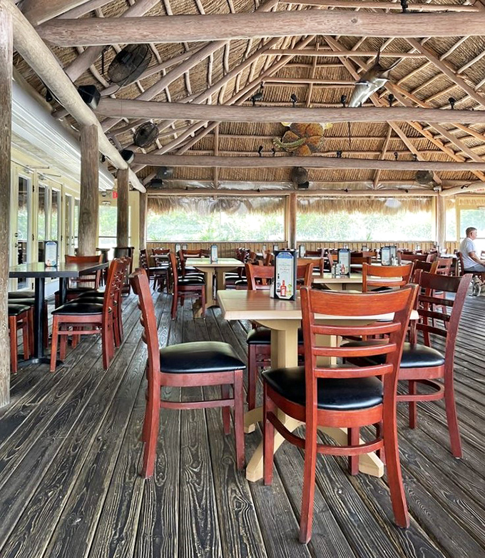 Wooden chairs, natural light, and views for days &ndash; this dining space proves sometimes the best seasoning is the scenery.