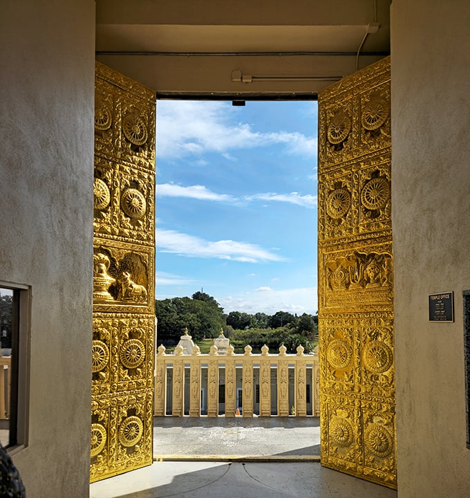 These golden doors aren't just entrances&mdash;they're portals between worlds, elaborately decorated with symbols that tell ancient stories.