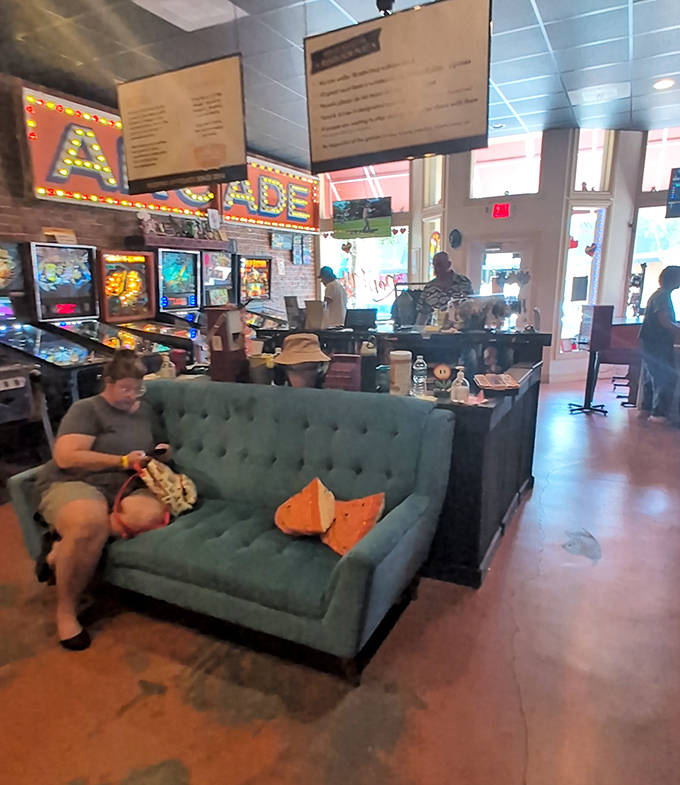 Between gaming sessions, this cozy lounge area invites visitors to rest their button-mashing fingers and share stories of arcade triumphs.