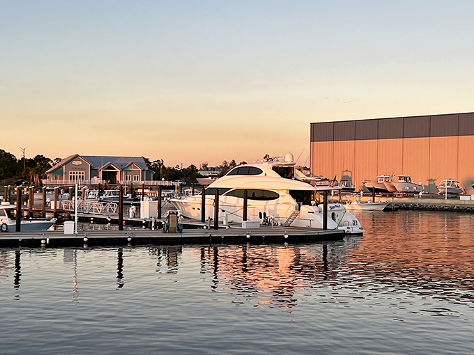 Golden hour transforms the marina into a postcard-perfect scene where luxury vessels rest after days of adventure on the water.