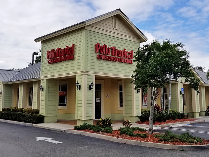 Pollo Tropical's vibrant facade promises Caribbean flavors that dance on your taste buds like a salsa beat.