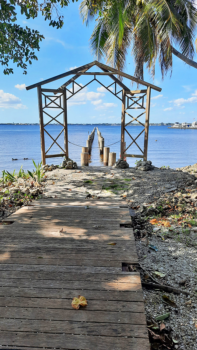 A weathered wooden pier stretches toward the horizon, framing a view that has captivated islanders for generations with its timeless beauty.