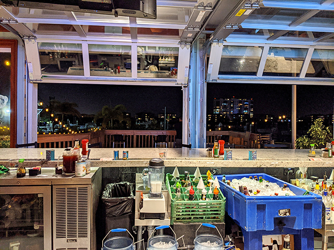 As night falls, the bar transforms into a twinkling oasis with the Tampa skyline creating a backdrop worthy of your social media feed.