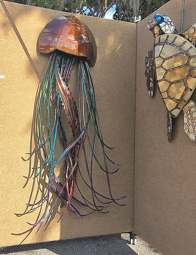 Metal jellyfish and turtle sculptures demonstrate how artists reimagine marine life, their metallic tentacles and shells capturing movement in static form.