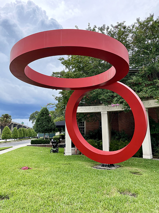 Modern art that makes you stop and stare &ndash; red rings suspended in conversation with gravity and your perception.