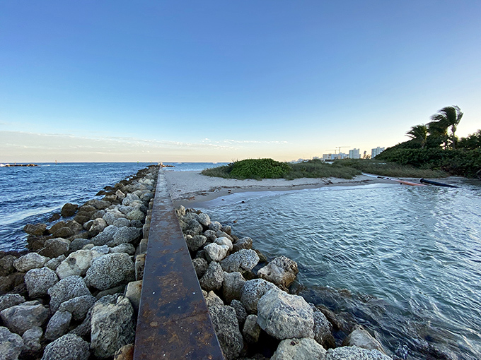Where rusty rails meet rocky shores, this jetty creates a perfect leading line to the vast Atlantic, promising adventure beyond the horizon.