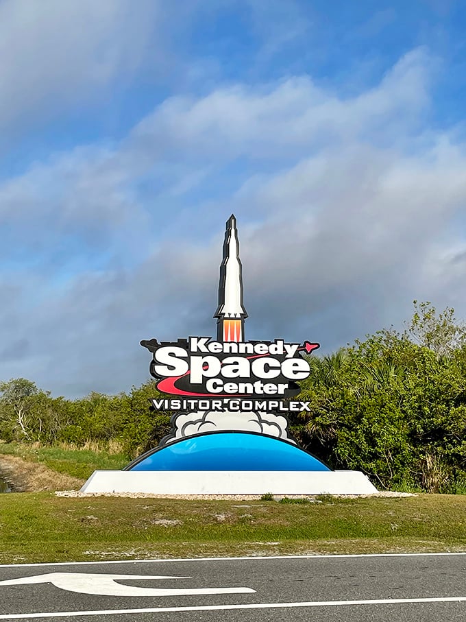 The Kennedy Space Center entrance sign promises visitors they're about to step onto hallowed ground in America's space program.
