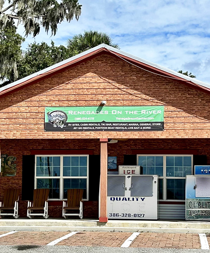The rustic wooden storefront announces your arrival at Renegades, where adventures on water and land await just beyond the entrance.