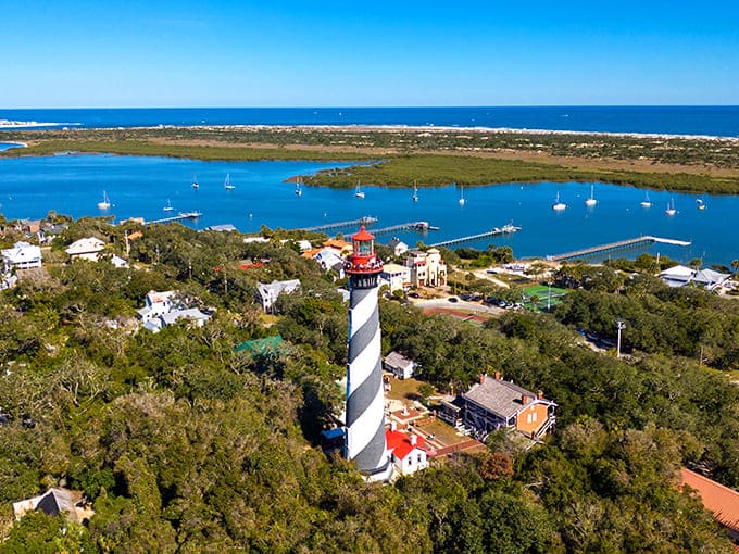 This aerial perspective shows how the lighthouse complex spreads across Anastasia Island like a perfectly preserved time capsule with excellent waterfront property.