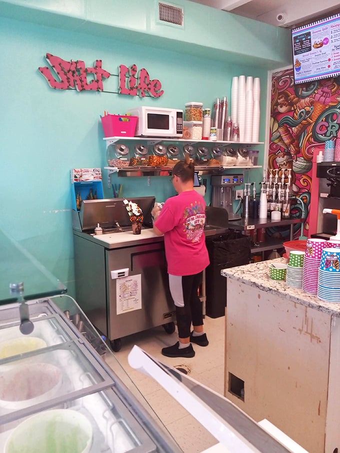 Staff members work their magic with practiced precision, turning ordinary ice cream into extraordinary memories one scoop at a time.