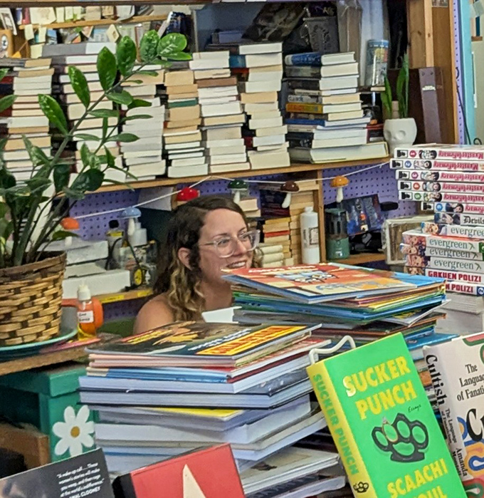 Behind every stack of books is a person who lovingly categorized them, creating order from literary chaos.