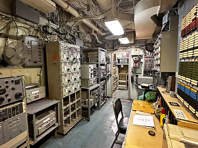 The radio room packed sophisticated communication equipment into a tiny space, connecting the ship to fleet command worldwide.