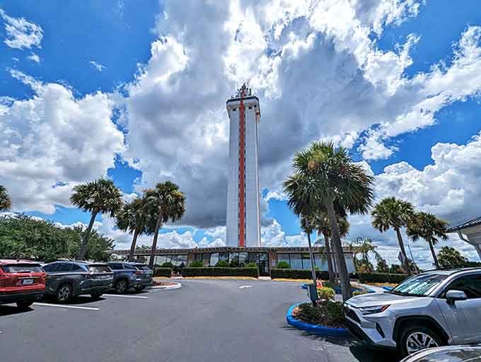 Tower Under Clouds: Even on cloudy days, the tower pierces the sky with determination, its red stripes adding a pop of color to the otherwise monochromatic scene.