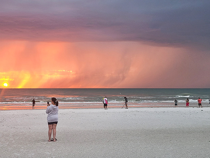 Beachgoers become silhouettes against nature's most spectacular canvas &ndash; a reminder that we're all just bit players in the sunset show.