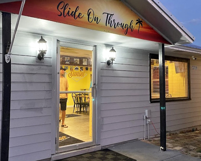 As evening approaches, the glow from inside Sunset Sliders beckons like a lighthouse guiding hungry travelers to safe, delicious harbor.