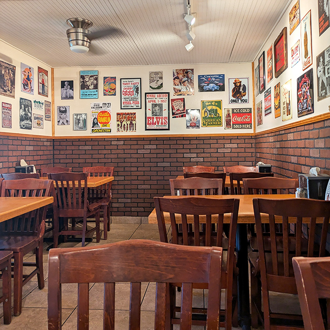 The dining area's brick wainscoting and walls covered with vintage signs create an atmosphere that feels earned rather than manufactured.