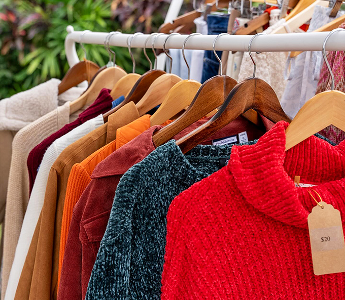 Vintage-inspired knitwear and jackets hang like colorful promises that yes, Florida does occasionally have sweater weather.