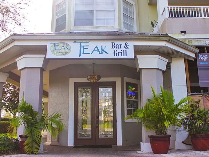 The welcoming entrance to Teak invites burger enthusiasts to discover why this neighborhood spot has developed a citywide following.