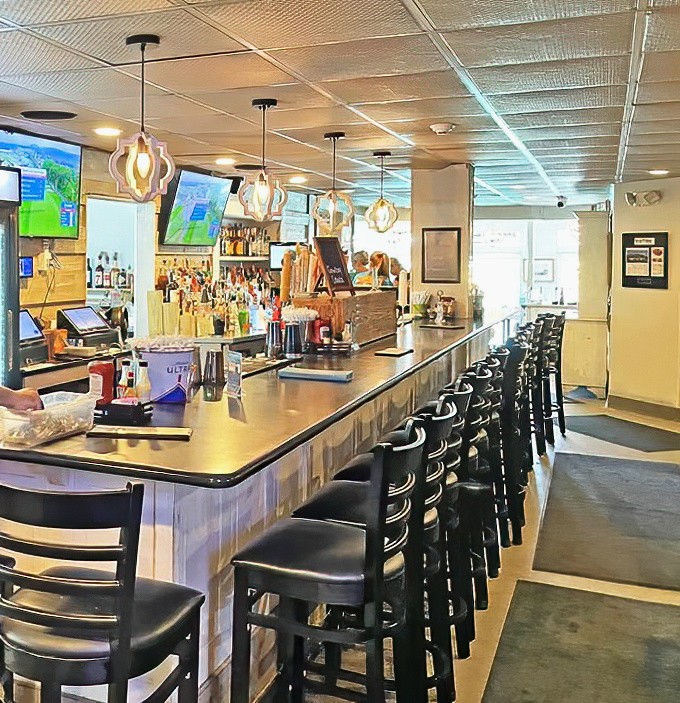 The indoor bar &ndash; where locals share fishing tales that grow taller with each round, and bartenders remember your usual before you do.