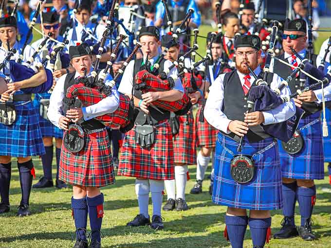 Massed pipe bands create a wall of sound so powerful it vibrates through your chest, making you understand why bagpipes were once used to terrify enemies on battlefields.