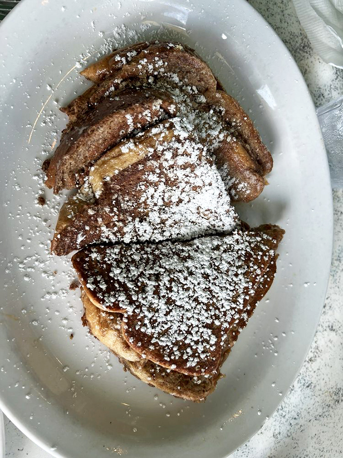 French toast dusted with powdered sugar &ndash; breakfast becomes dessert becomes art in this simple morning pleasure.
